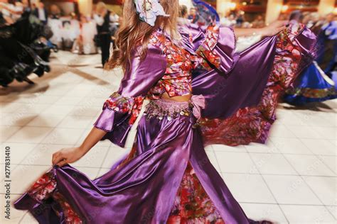 Beautiful Gypsy Girls Dancing In Traditional Purple Floral Dress At