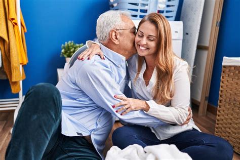 Middle Age Man And Woman Couple Hugging Each Other And Kissing Waiting