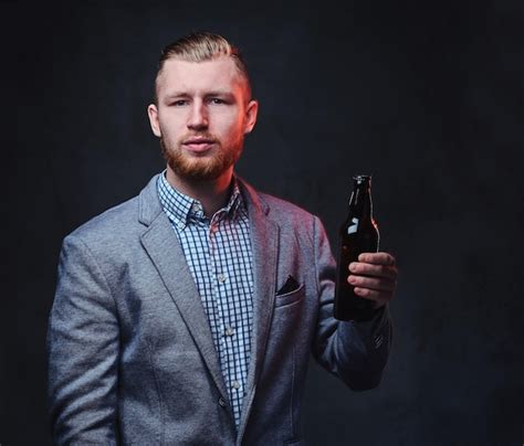 Premium Photo Stylish Redhead Bearded Male Dressed In A Suit Holds A