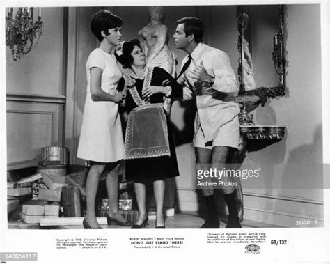 Mary Tyler Moore And Robert Wagner Tugging At Maid In A Scene From