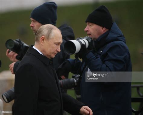 Russian President Vladimir Putin Walks Past The Photographers Leaving