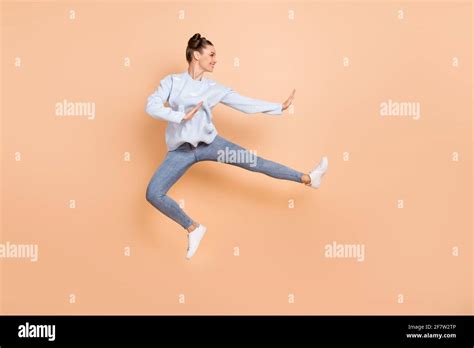 Full Size Profile Photo Of Optimistic Nice Brunette Lady Jump Karate