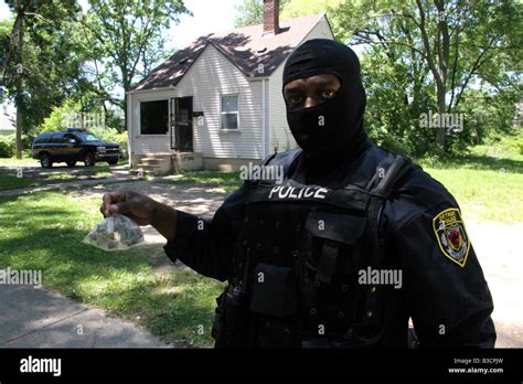 Detroit Narcotics Police Officer Holding A Bag Of Cannabis Found During