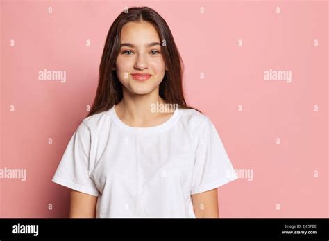 Half Length Portrait Of Young Pretty Girl In White T Shirt Isolated On