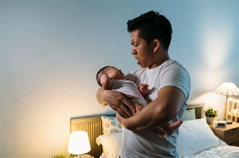 Premium Photo Portrait Nervous Asian First Time Dad Is Comforting His