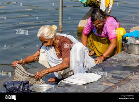Women Washing Clothes Lake Pichola Udaipur Rajasthan India Stock