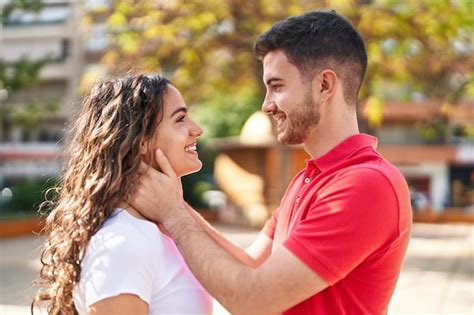 Free Photo Young Hispanic Couple Smiling Confident Hugging Each Other