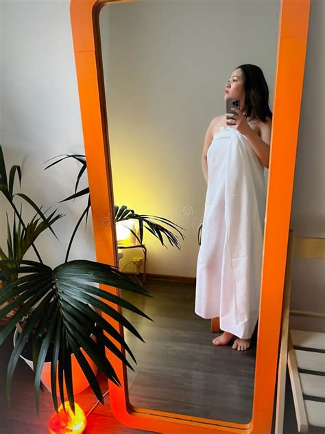 Young Woman Wapped In Gown Shooting Herself In Mirror At Spa Salon