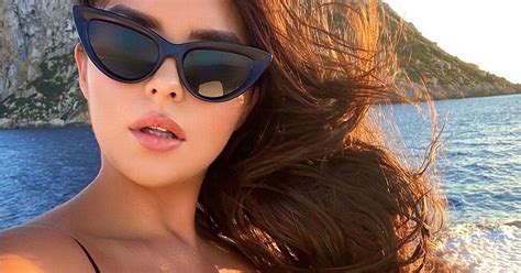 Demi Roses Boobs Steal Show As She Pours Curves Into Thong Swimsuit