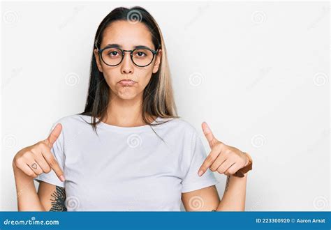 Young Hispanic Woman Wearing Casual White T Shirt Pointing Down Looking