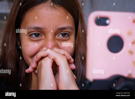 Latin Hispanic Teenage Guatemalan Girl Enjoying Video Call On Phone