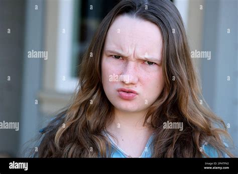 Shot Of Dissatisfied Girlfriend Frowns Face Raises Eyebrows In