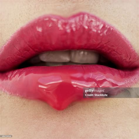 Closeup Of Pink Lipstick Dripping Off A Womans Mouth High Res Stock