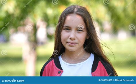 Portrait Of A Smiling 11 Year Old Girl With Long Hair Stock Image