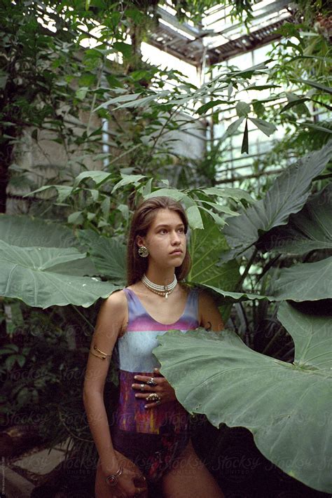 Young Girl In A Swimsuit Among Plants By Stocksy Contributor Synchro