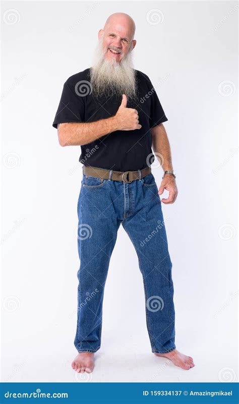 Full Body Shot Of Happy Mature Bald Bearded Man Giving Thumbs Up Stock
