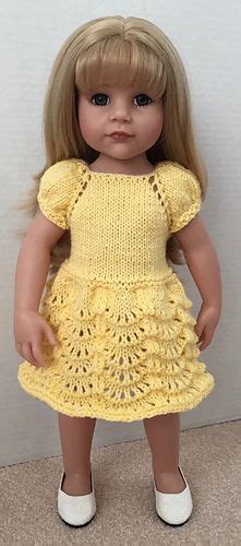 A Doll With Blonde Hair Wearing A Yellow Crochet Dress And White Tennis
