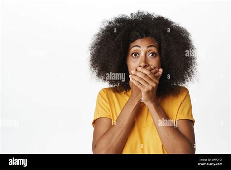 Close Up Portrait Of Shocked African American Woman Gasping Covering