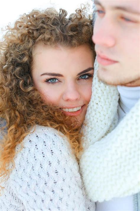 Close Up Muzzle Of Husky With Kissing Couple In Winter Background