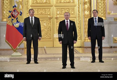 Russian President Vladimir Putin Stands With Foreign Minister Sergey