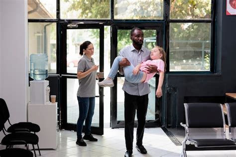 Premium Photo Worried African American Dad Holding Unconscious