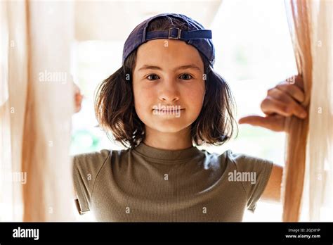 Summer Portrait Of Young Pretty Happy Girl In An Turned Baseball Cap