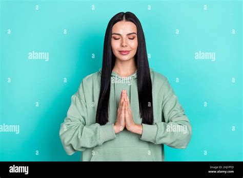 Photo Of Nice Millennial Brunette Lady Hold Palms Wear Green Hoodie