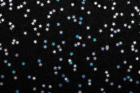 Premium Photo Iridescent Silver Stars Confetti On Black Festive