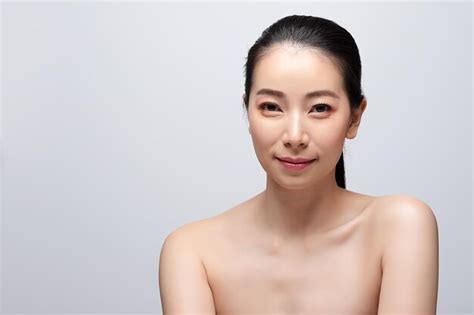 Premium Photo Portrait Of Shirtless Woman Against Gray Background