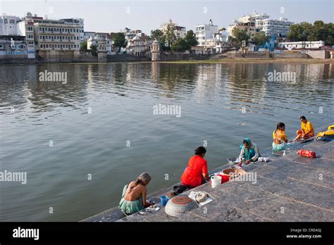 Indian Women Washing Their Laundry On The Shore Ghat Lake Pichola