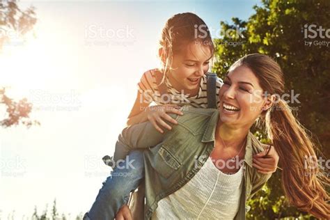 Shot Of A Mother And Her Daughter Bonding Together Outdoors Stock