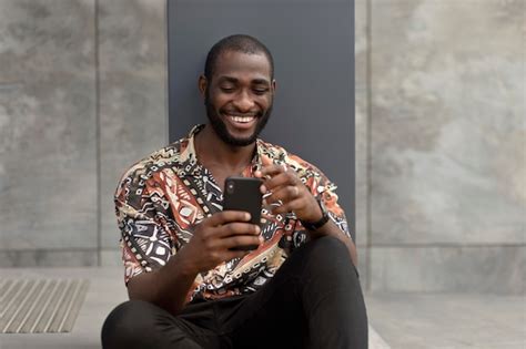 Free Photo Handsome Man Using Modern Smartphone Outdoors