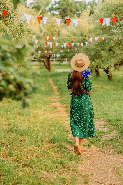 Premium Photo Beautiful Redhaired Girl In A Green Dress On A Walk In