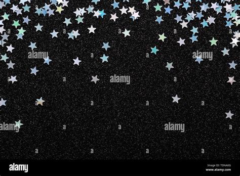 Falling Iridescent Silver Stars Confetti On Black Festive Holiday