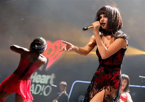 Selena Gomez Holding Microphone Hd Wallpaper Wallpaper Flare