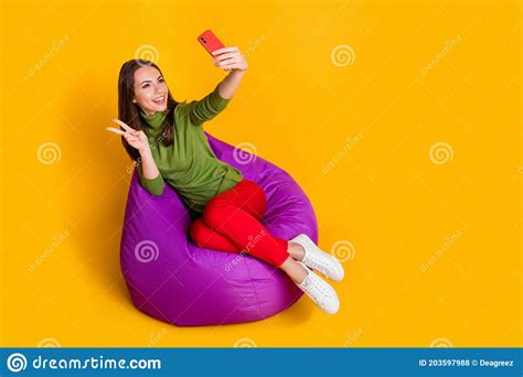 High Angle View Photo Of Lady Sit Bean Bag Telephone Take Selfies Show