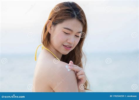 Beauty Attractive Asian Young Woman Smile With Healthy Skin Applying