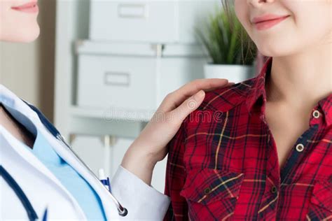 Friendly Female Doctor Touching Patient Shoulder Telling Good Ne Stock