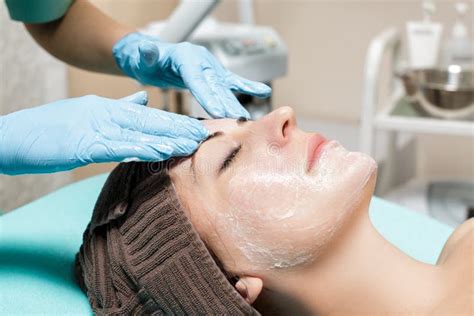 Anti Aging Facial Massage Cosmetologist Doing Massage For Young Woman