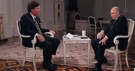 Vladimir Putin Uses Hand To Control Shaking Leg During Tucker Carlson