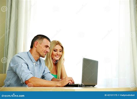 Couple Using Laptop Together At Home Stock Image Image Of Horizontal
