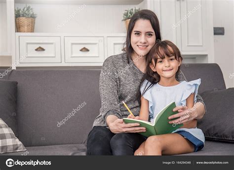 Mother Teaching Her Daughter How To Write Home School Concept — Stock