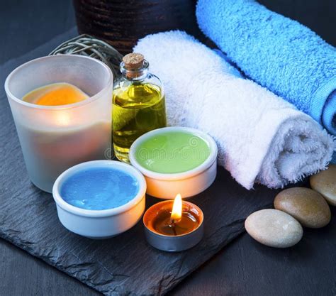 Spa Setting With Towels Face Mask Bath Salt And Oil And Candle Stock