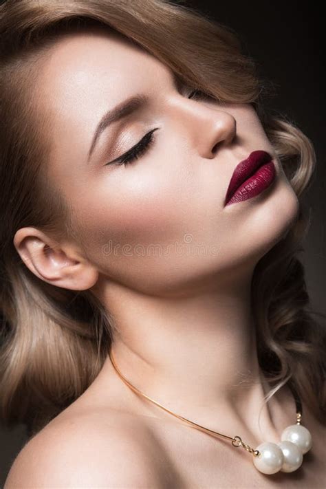 Beautiful Blonde In A Hollywood Manner With Curls Natural Makeup And