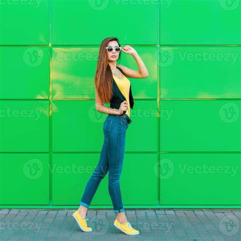 Fashion Young Beautiful Woman In Sunglasses Standing Near The Bright