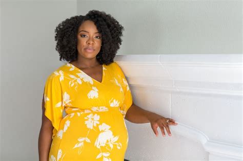 Young Pregnant Woman Holding Her Stomach Smiling Clinique Ndt