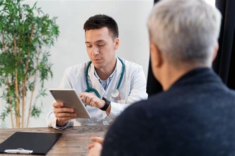 Premium Photo The Doctor Communicates With Patients In His Office