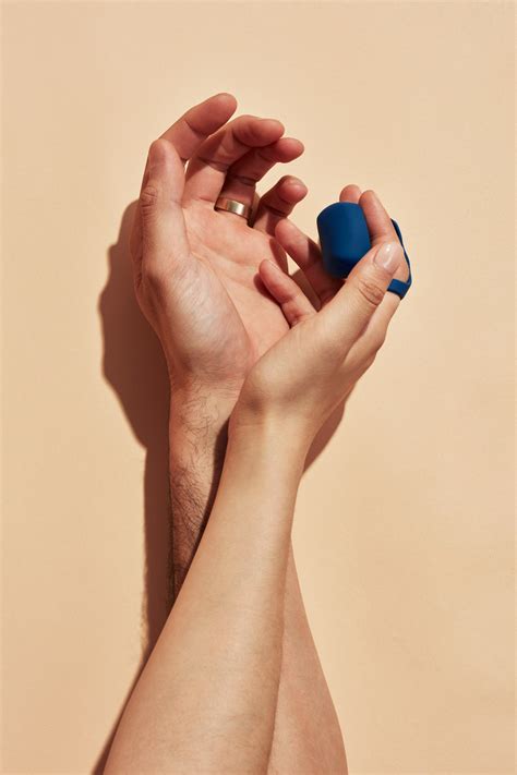 dame s compact fin vibrator slots between two fingers