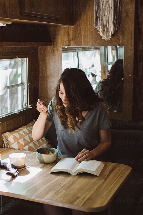 «woman Reading And Eating Breakfast Del Colaborador De Stocksy «carey
