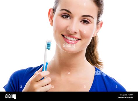 Beautiful Woman With A Great Smile Holding Toothbrush Isolated Over A